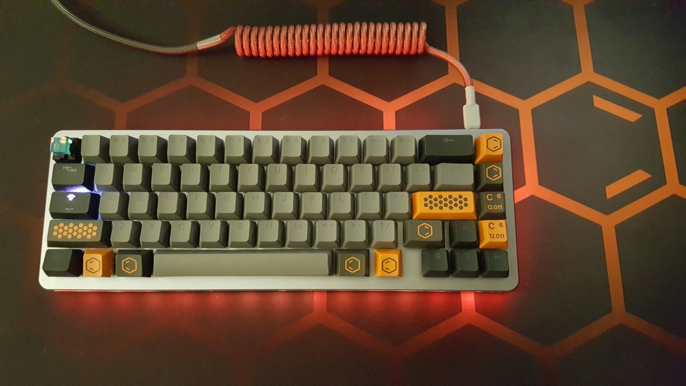 Complete with themed desk mat and GMK Carbon Novelty keycaps. | Drop